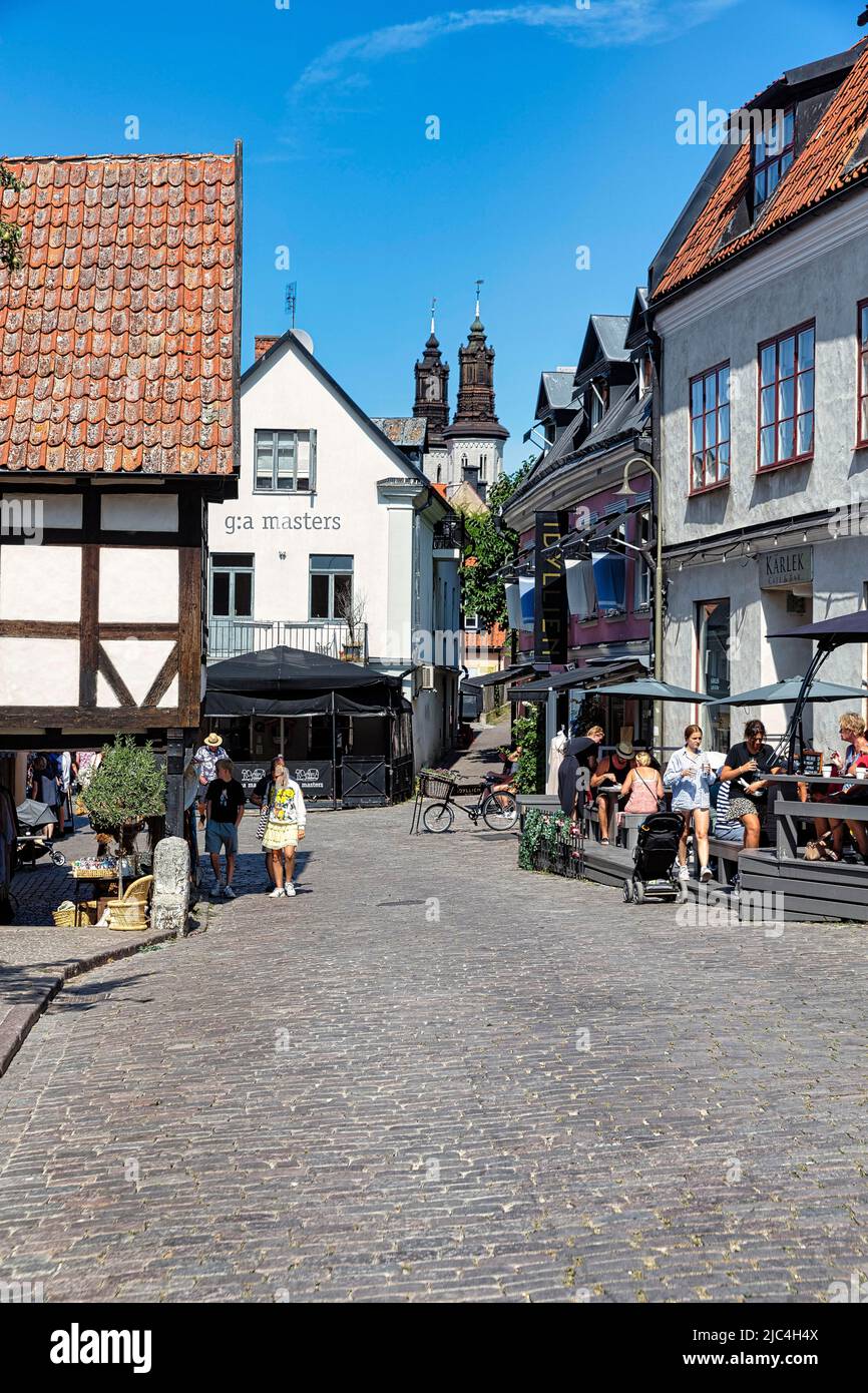Restaurants with tourists in the pedestrian zone, old town in Visby ...