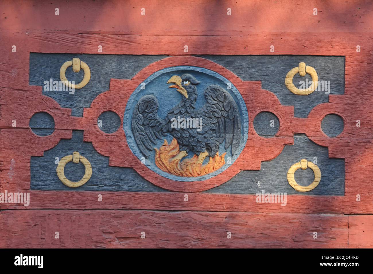 Wood carving with firebird at the historic Amthof in Bad Camberg, Hesse ...