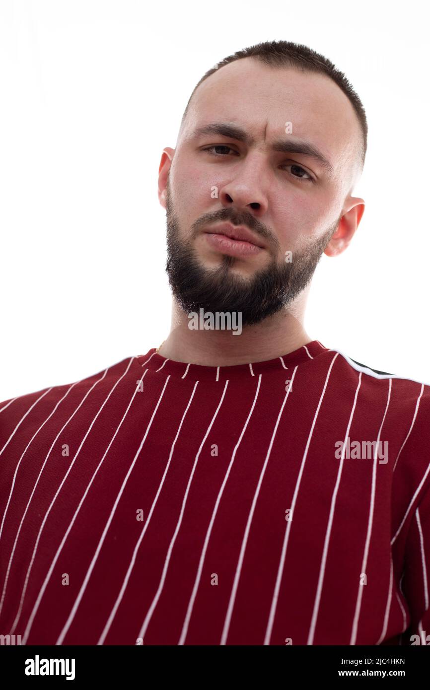 Closeup headshot vertical image of unshaven frowned man face looking at ...