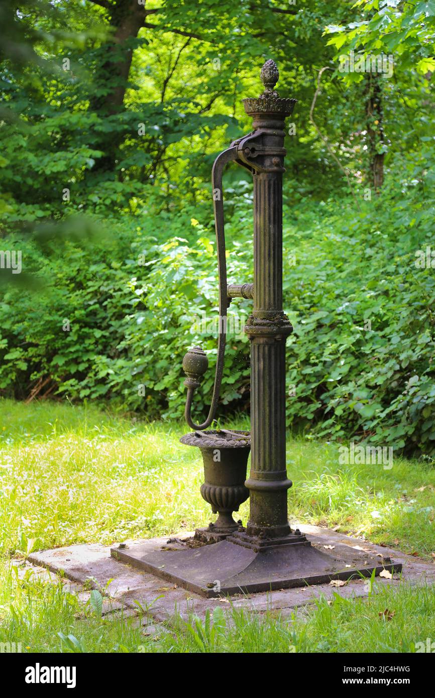 Old fountain with hand pump, water pump, park of the Villa Louis ...