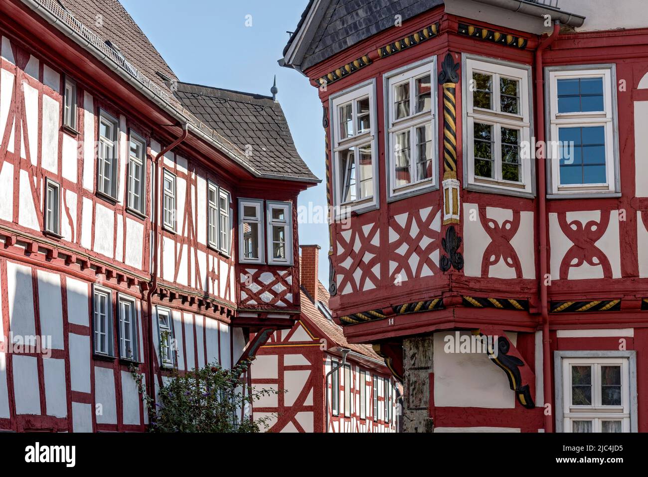 Medieval half-timbered houses with bay windows at the corner of the ...