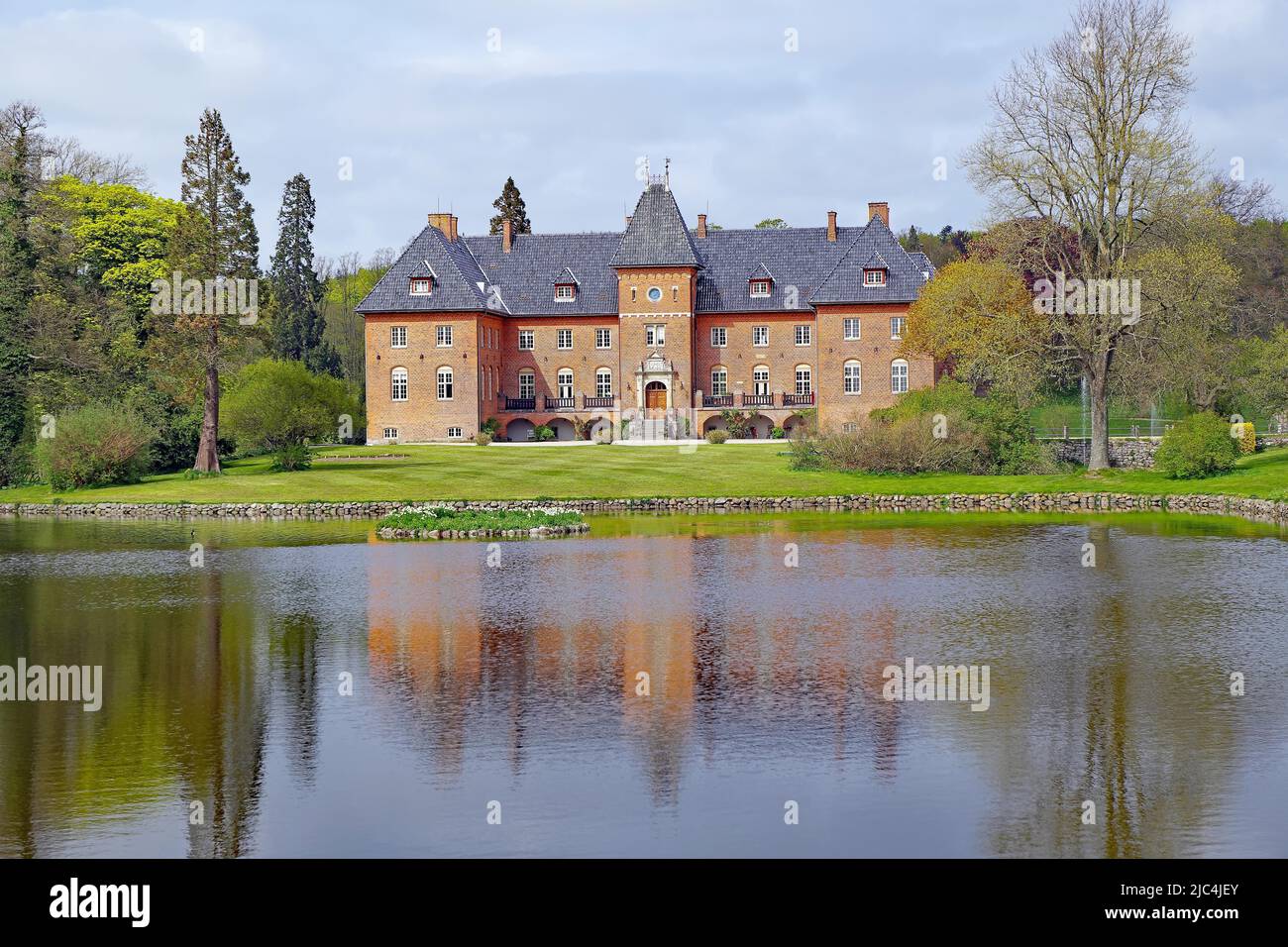 Manor house reflected in a body of water, parks, Holstenhus, Funen ...