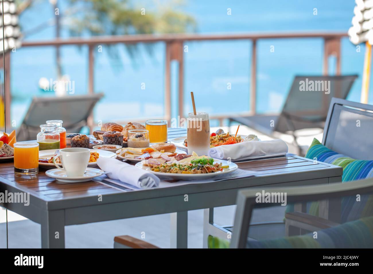 Breakfast in tropical hotel with sea view. Buffet food in restaurant in ...