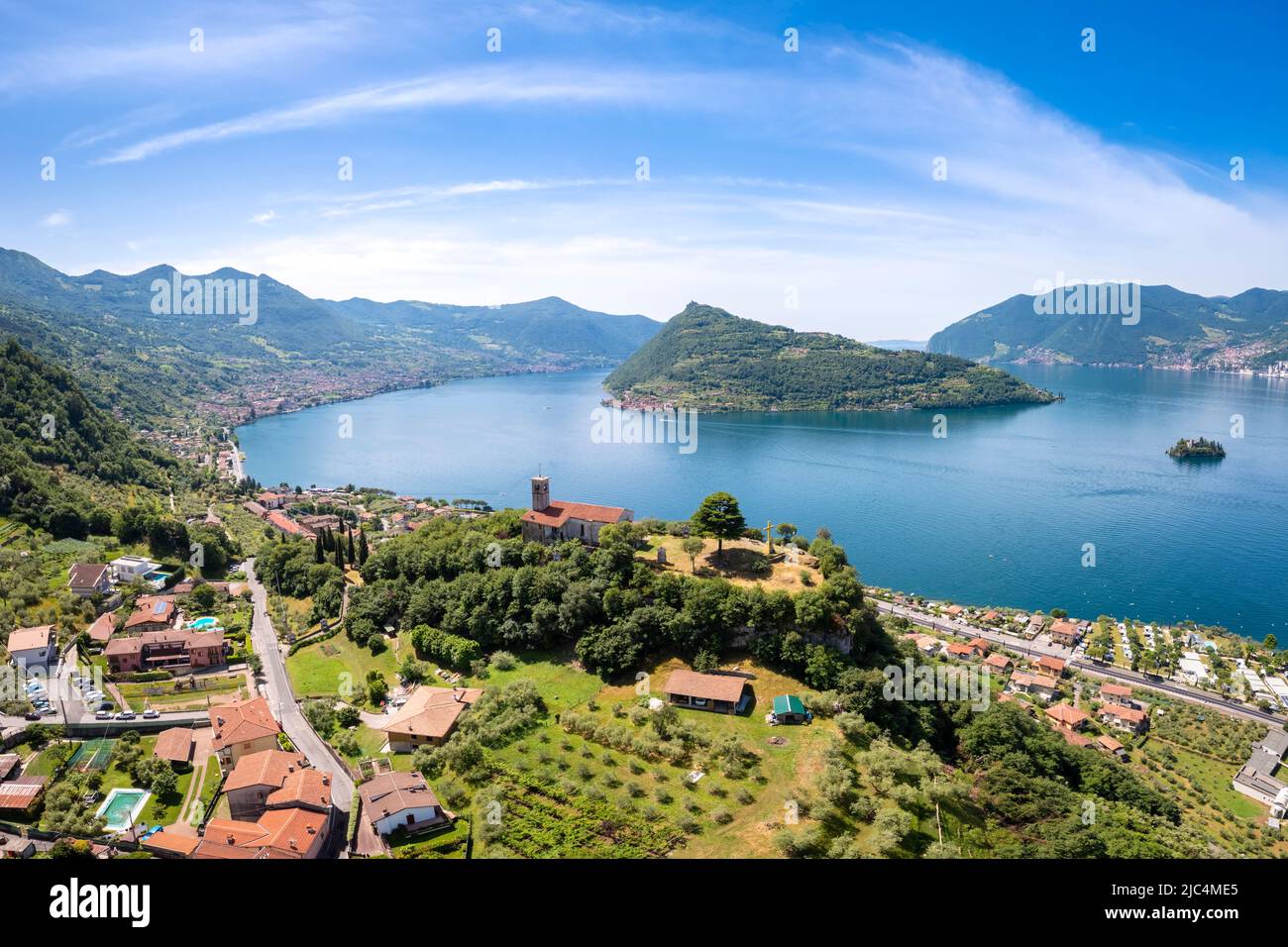 Aerial view of the Eremo di San Pietro church on a hill dominating Iseo ...