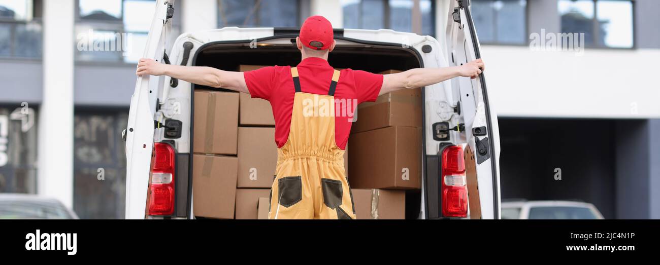 Persons standing with back and close car door with both hands Stock ...