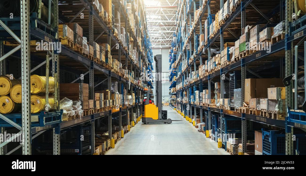 Modern distribution warehouse interior with many goods in boxes on ...