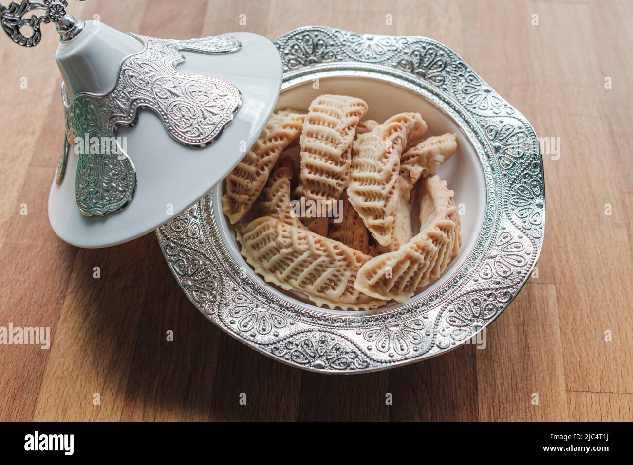 Homemade sweets from gazelle horns for Ramadan. Close-up detail shot of ...