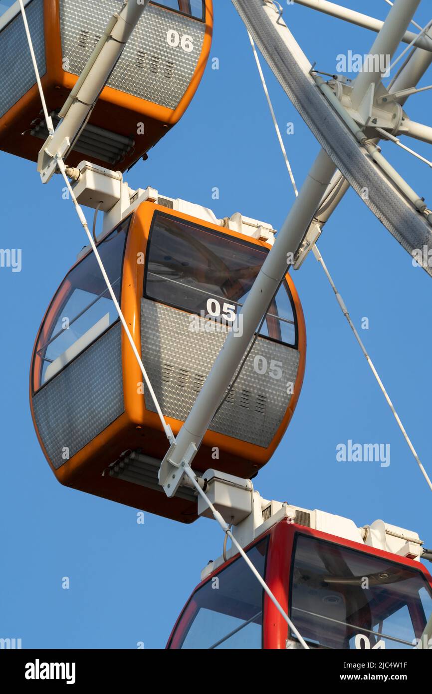 Closeup of colorful cabins of giant ferris wheel in amusement park ...