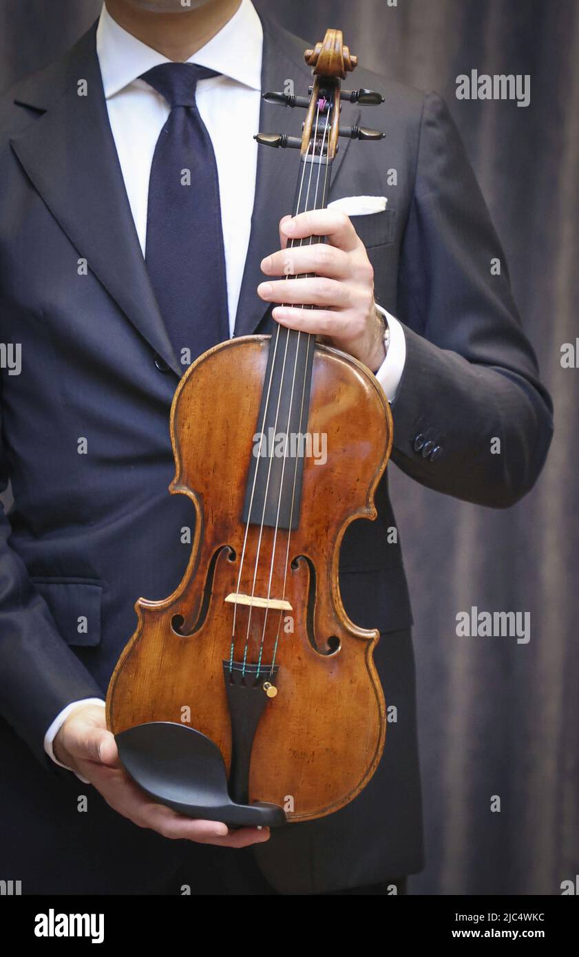 A violin made by Italian stringed instrument craftsman Antonio ...