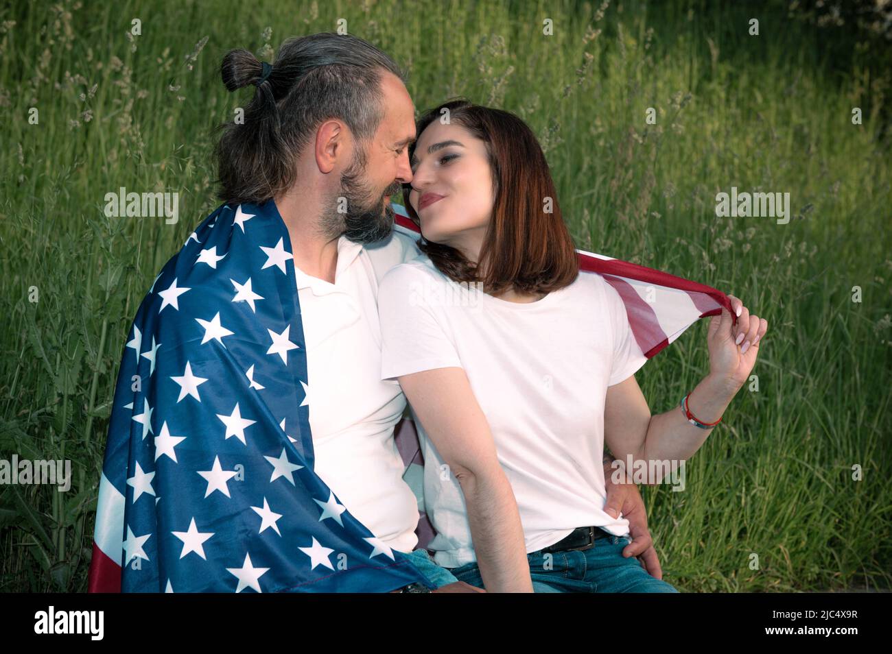 Loving couple celebrating USA Independence Day. Couple in love kissing ...