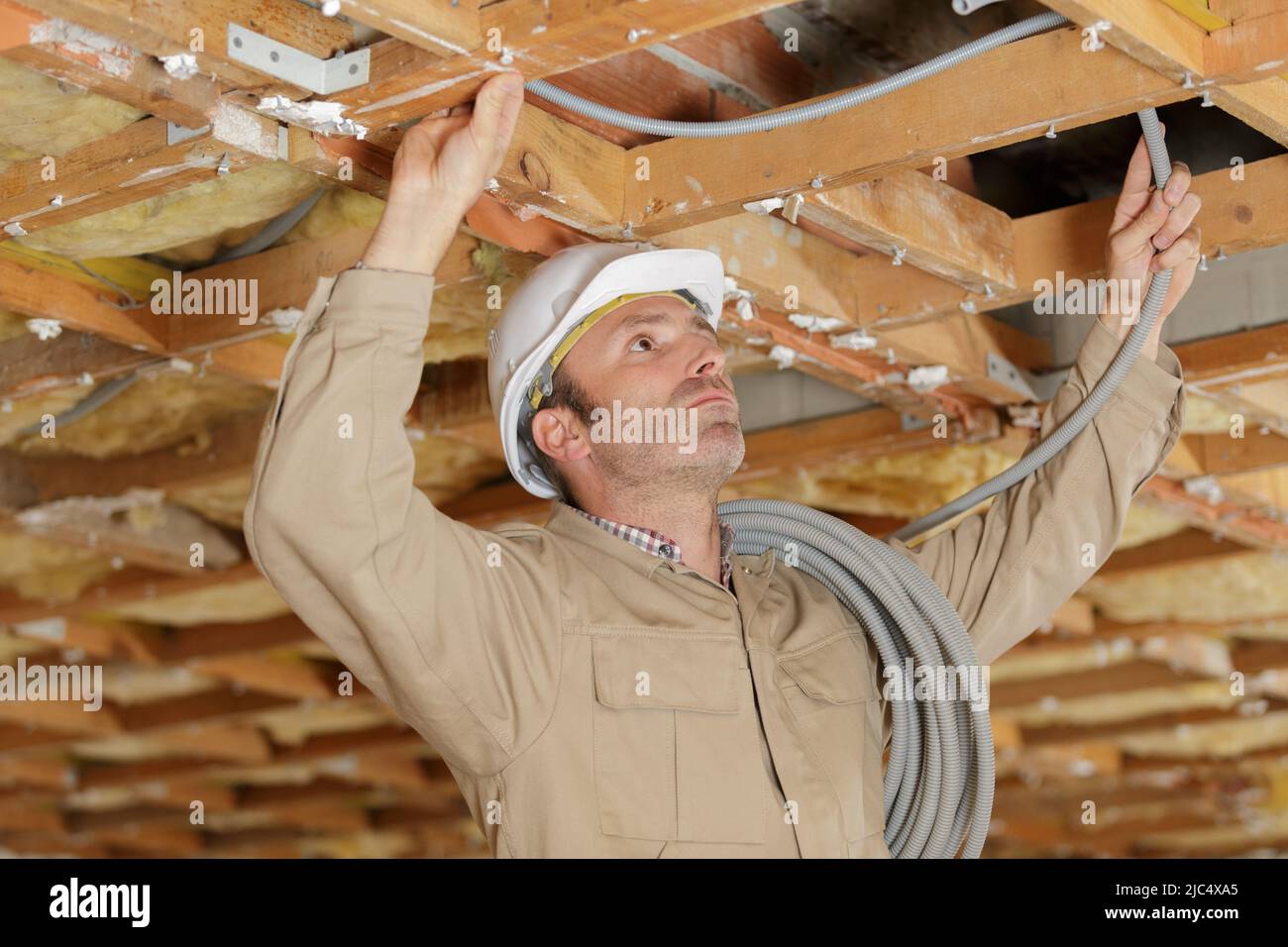 man working with wood structure Stock Photo - Alamy