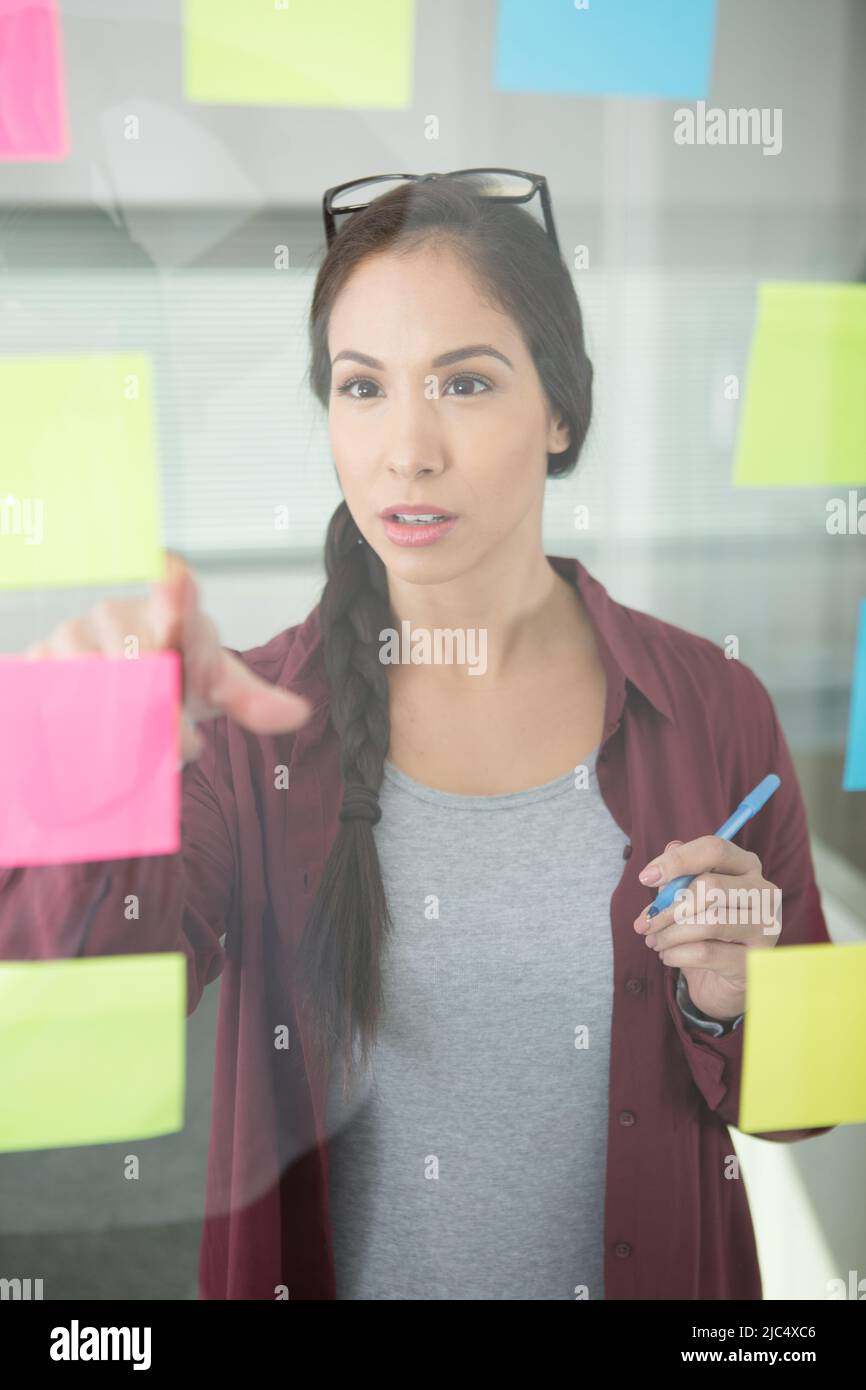 Female office workers using glass hi-res stock photography and images ...