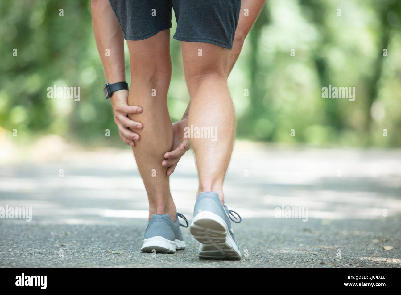 man with sprain thigh muscles Stock Photo - Alamy