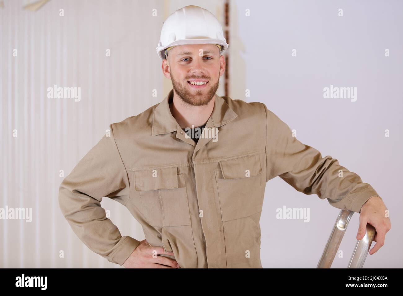 portrait of male builder in proerty under renovation Stock Photo - Alamy
