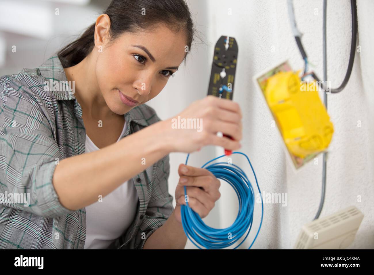 female electrician at work Stock Photo - Alamy