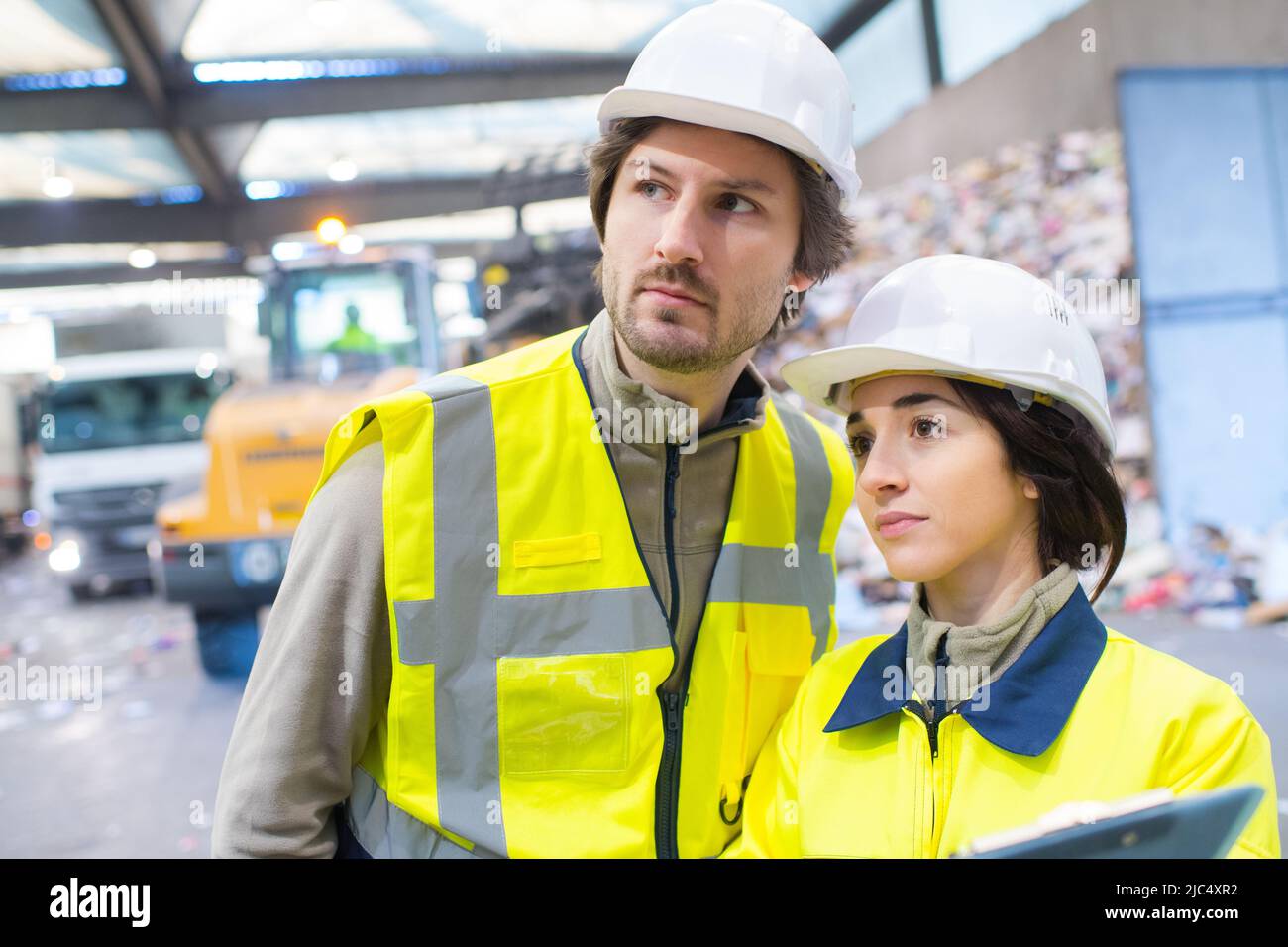 sanitation workers working in recycling plant Stock Photo - Alamy