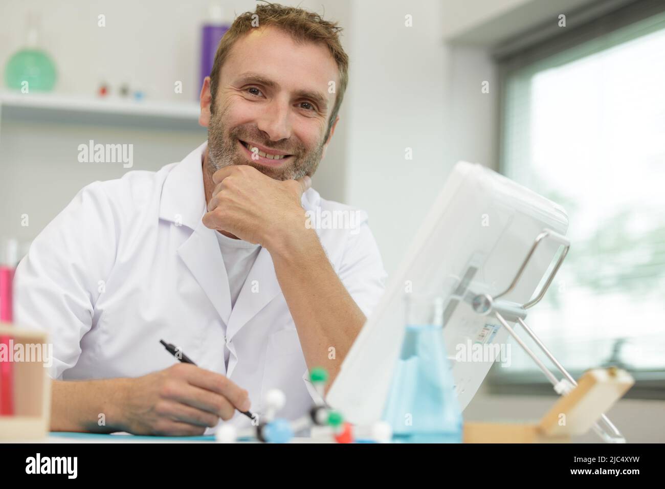smiling mature male doctor in lab Stock Photo - Alamy