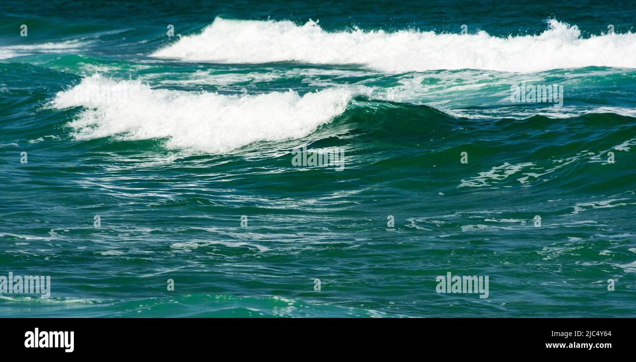 abstract sea background. green wave close up. blurry water in evening ...