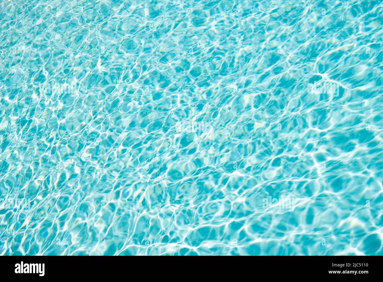 summer blue swimming pool rippled water background Stock Photo - Alamy