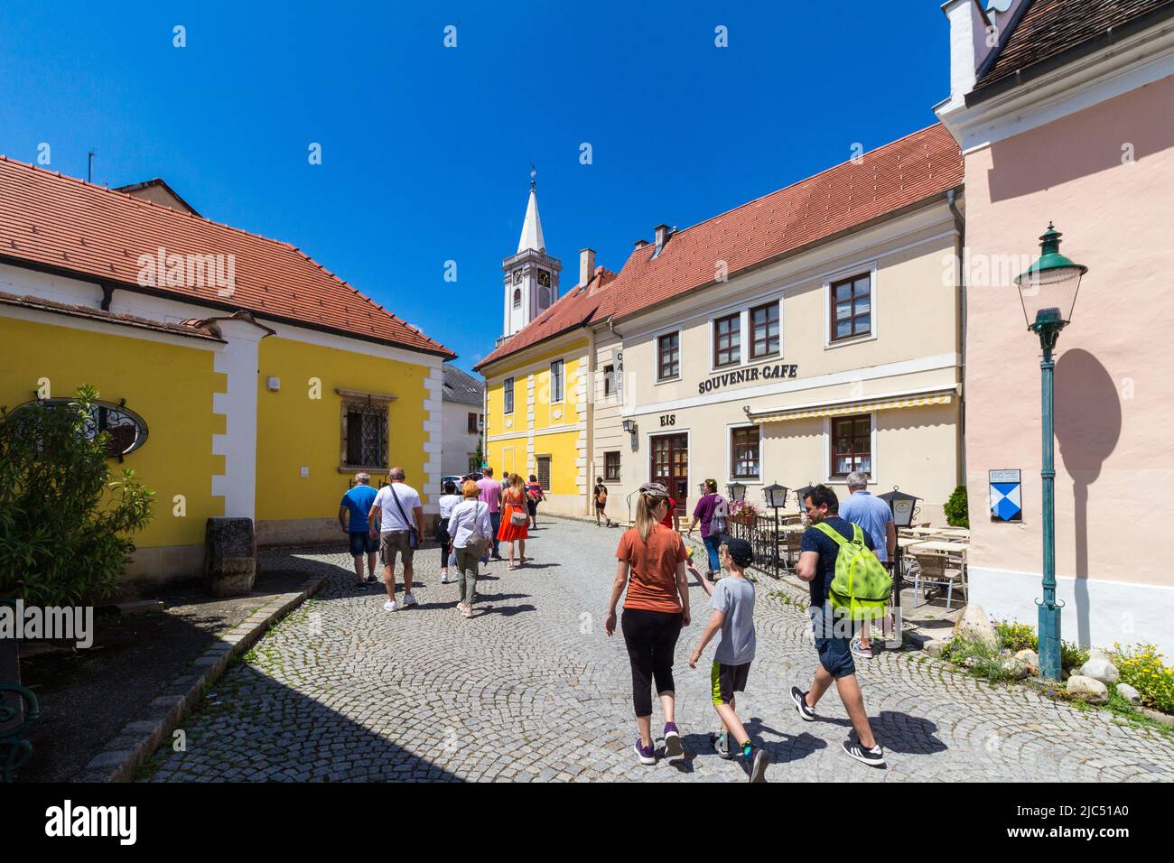 Tourists walking in old inner-city of Rust am See, Burgenland, Austria ...