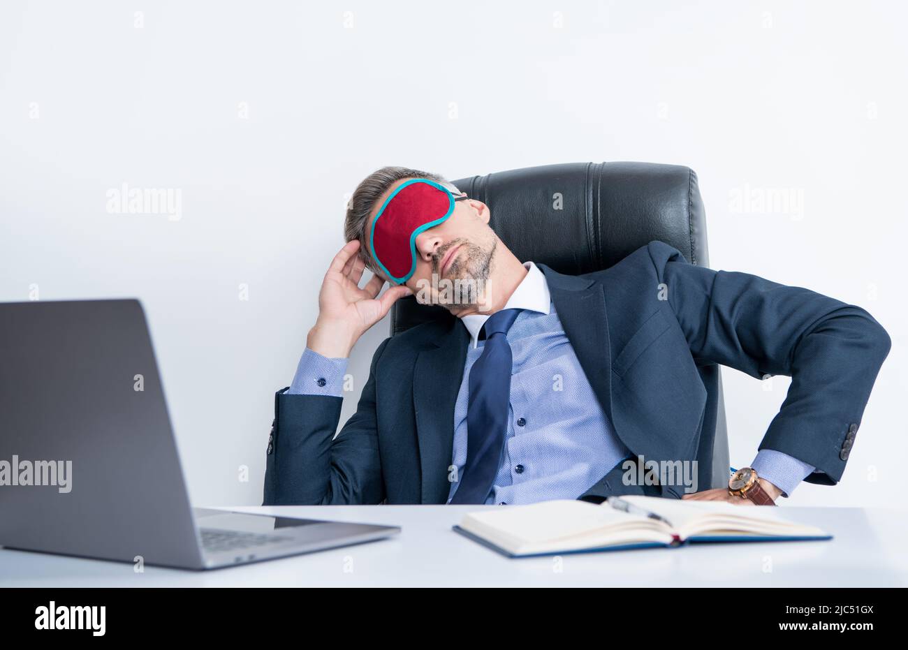 tired employer relax in sleep mask at workplace Stock Photo - Alamy