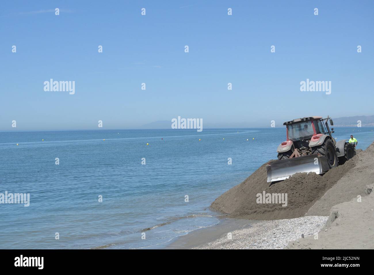 Tractor moving sand hi-res stock photography and images - Alamy