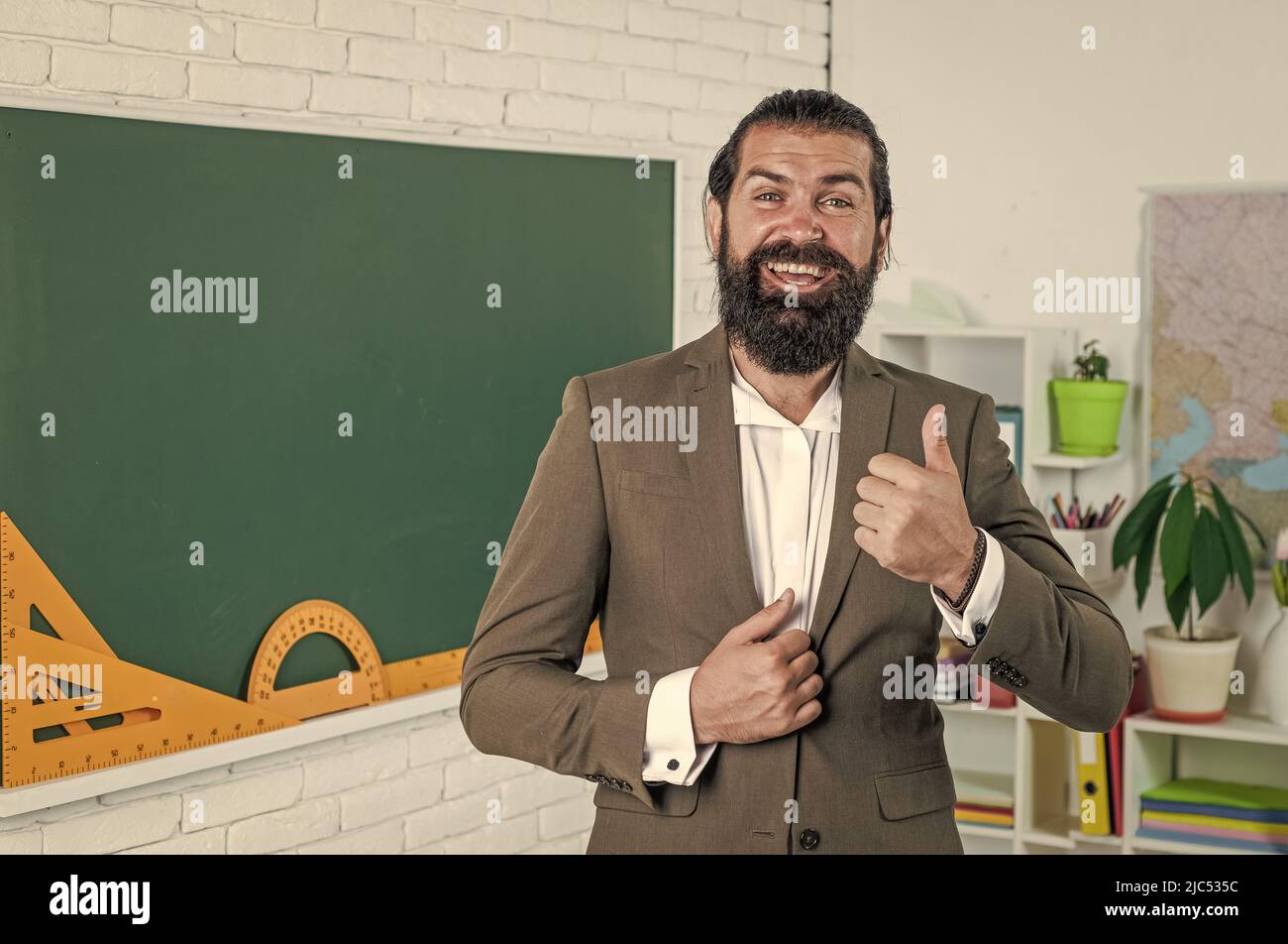 happiness. male student sit in classroom while lesson. pass the exam ...