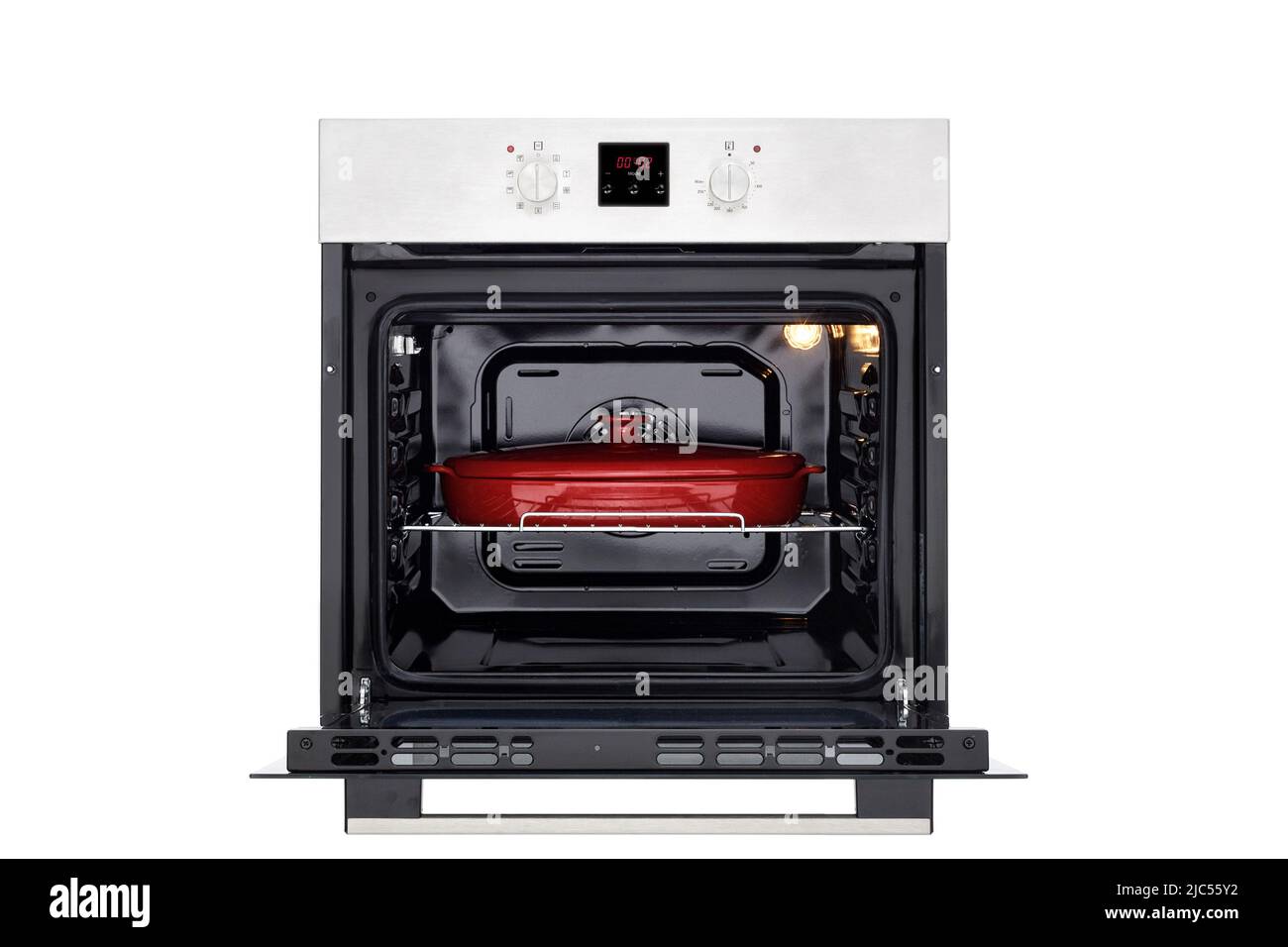 Electric oven with open door, illuminated and red baking dish. Front ...