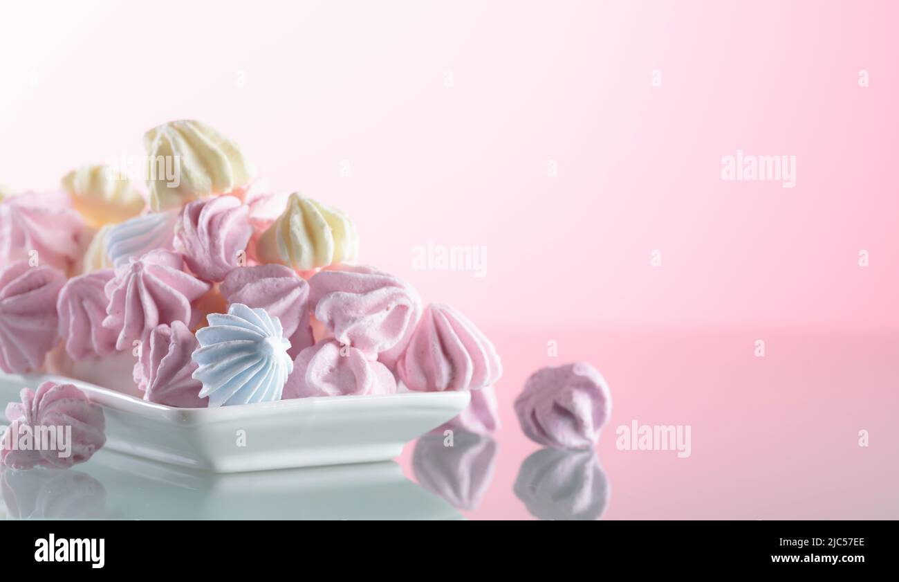 Homemade colorful meringue on a glass table. Copy space Stock Photo - Alamy
