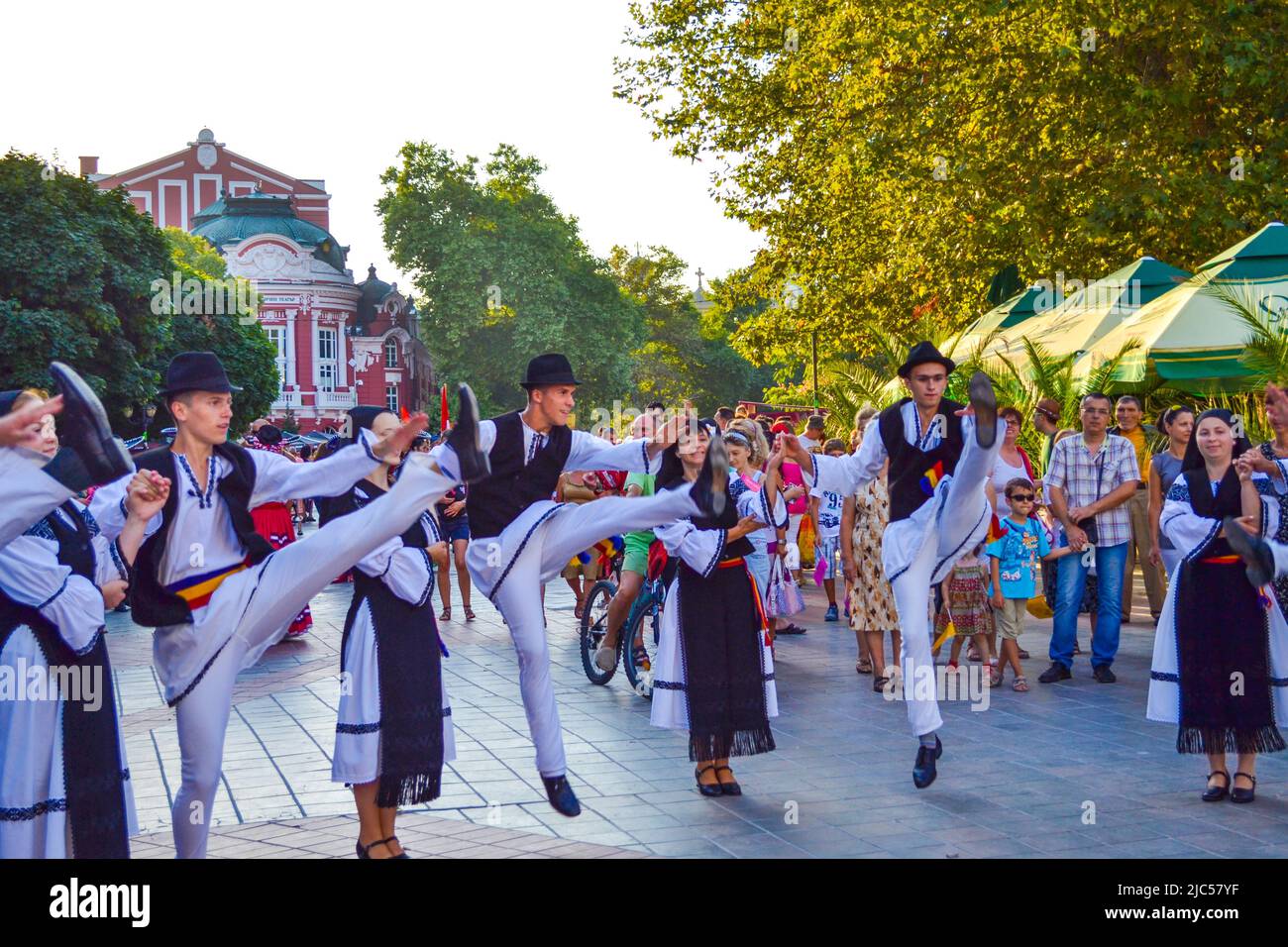 Romanian dancers dressed in traditional costumes performing at street ...