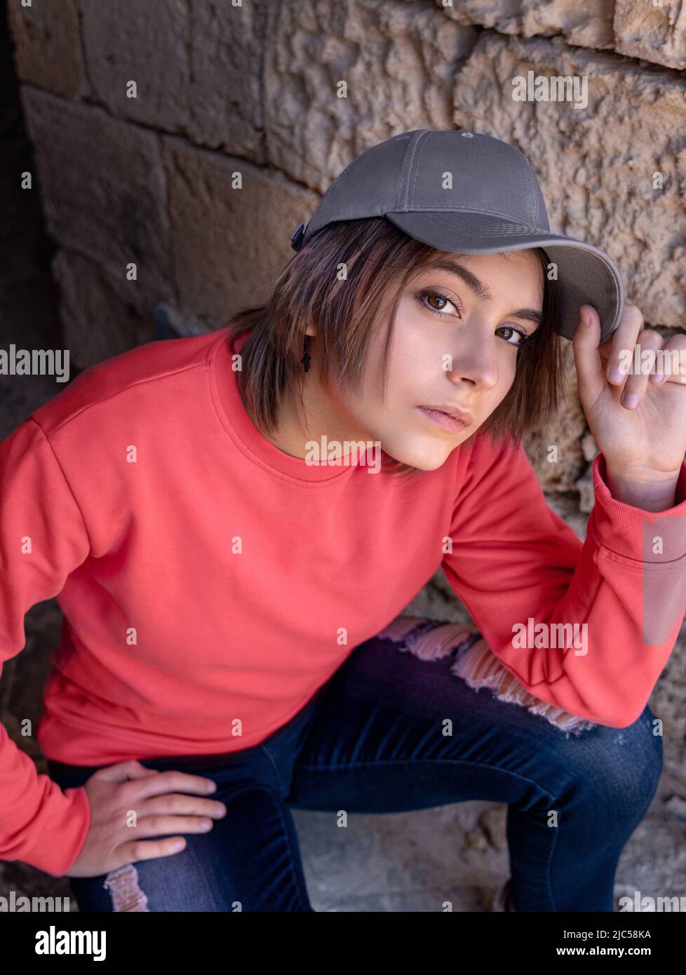 Teen girl looking at camera thinking hi-res stock photography and ...