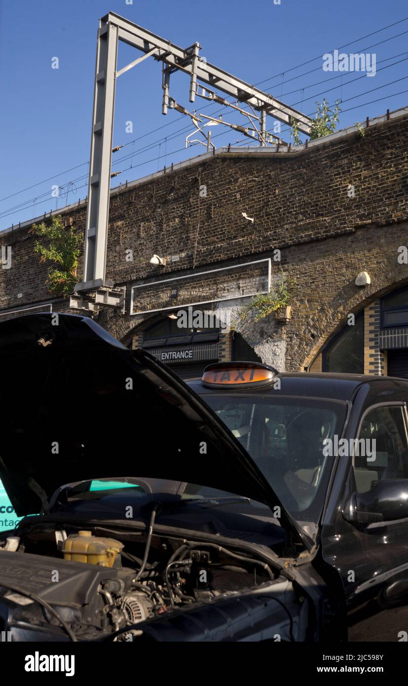 Taxi repair garage business redeveloped under railway arches by train ...