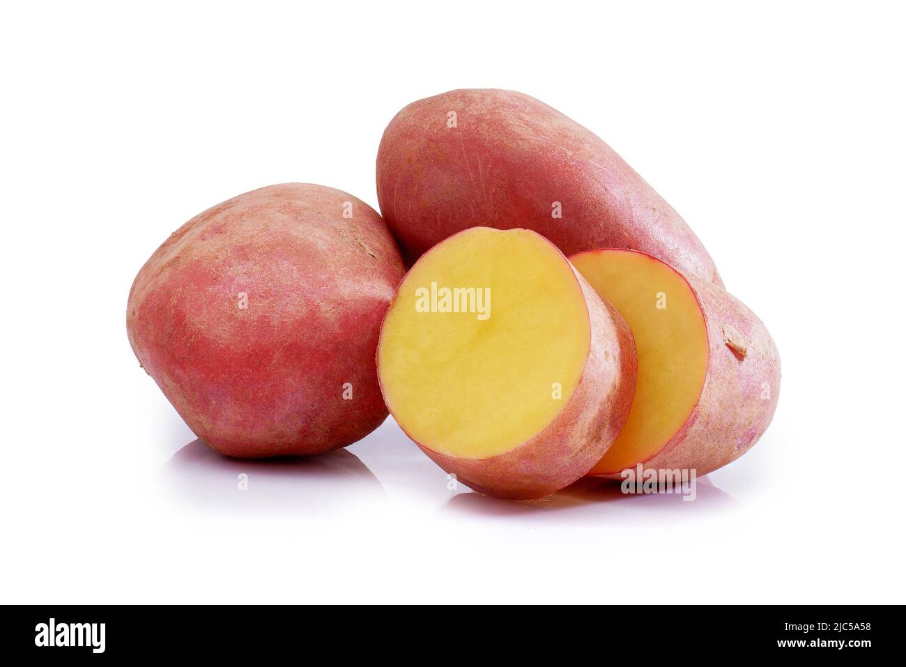 Clean ripe potato tubers isolated on white background. Washed red ...
