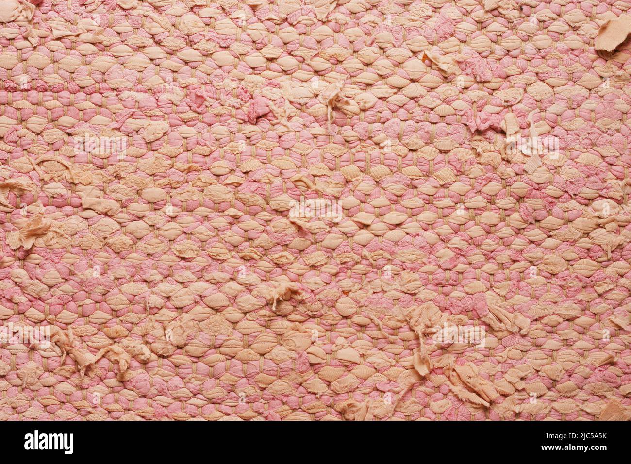 Rag rug close up. Recycled fabric. Pink, white weaved texture ...
