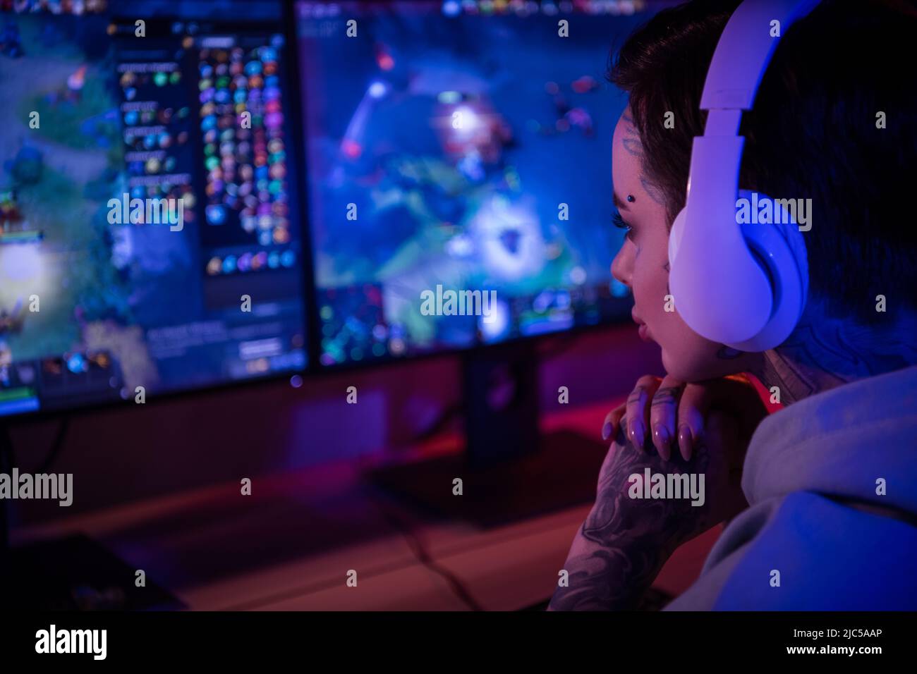 Cropped profile portrait of professional gamer girl look two displays ...