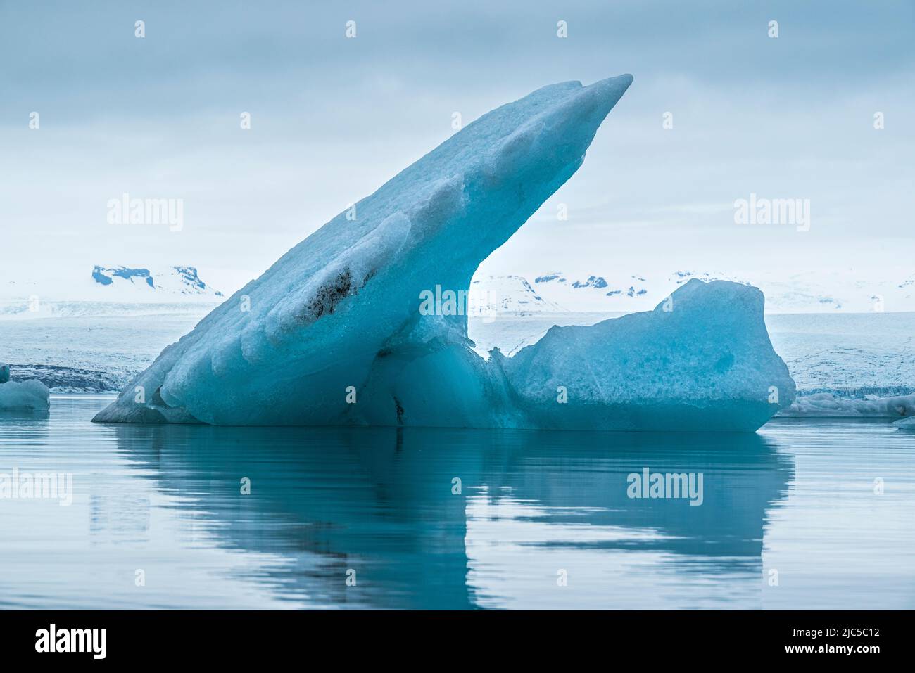 Bizarre shaped iceberg floating in the Jökulsárlón glacier lagoon ...