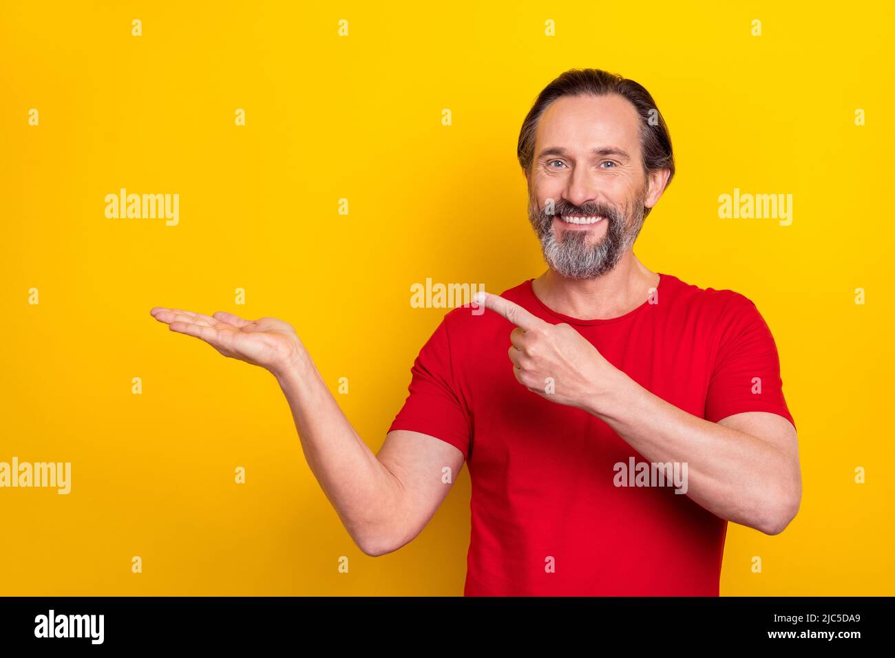 Photo of funny mature brunet man hold promo wear trend cloth isolated ...