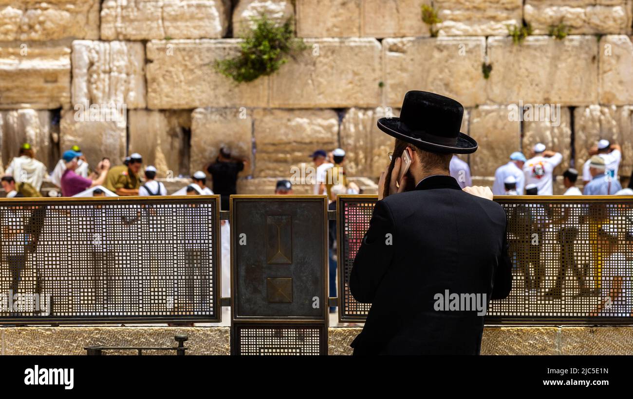 An Orthodox Jew Talks On A Mobile Phone In Front Of The Wailing Wall ...