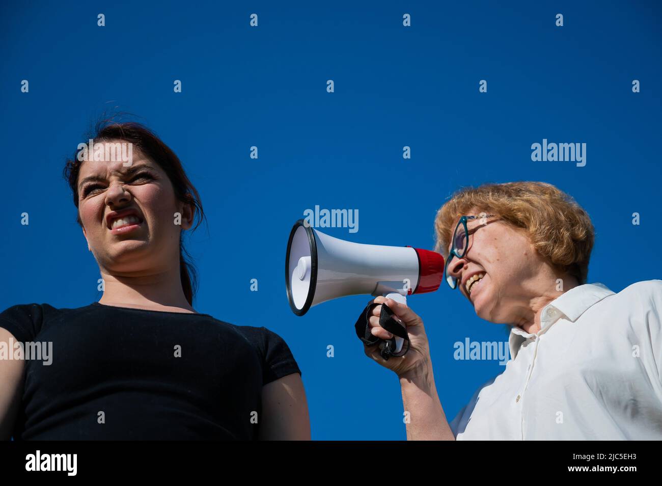 The Conflict Of Generations An Emotional Elderly Woman Shouting At Her