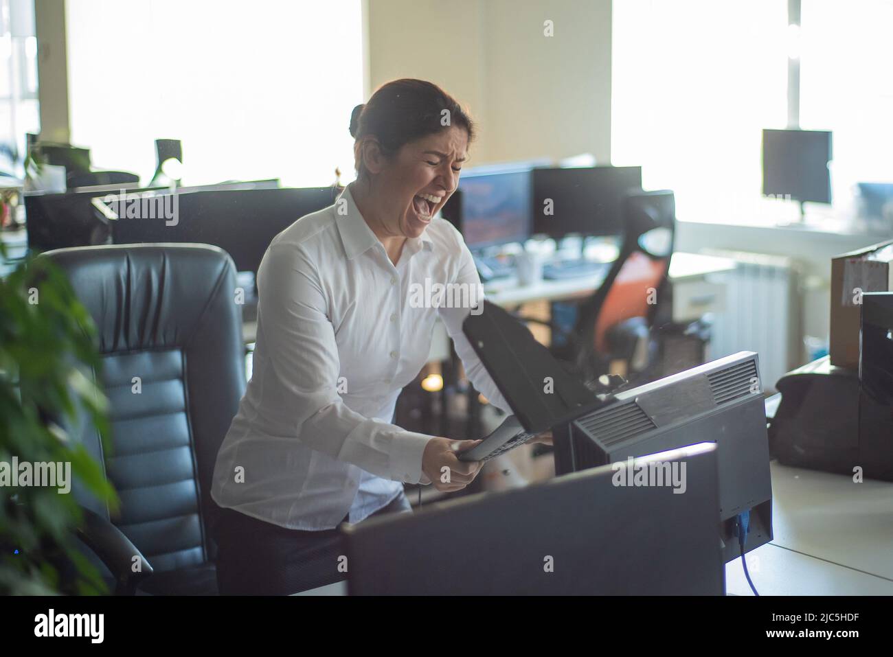 Woman angry computer typing hi-res stock photography and images - Alamy