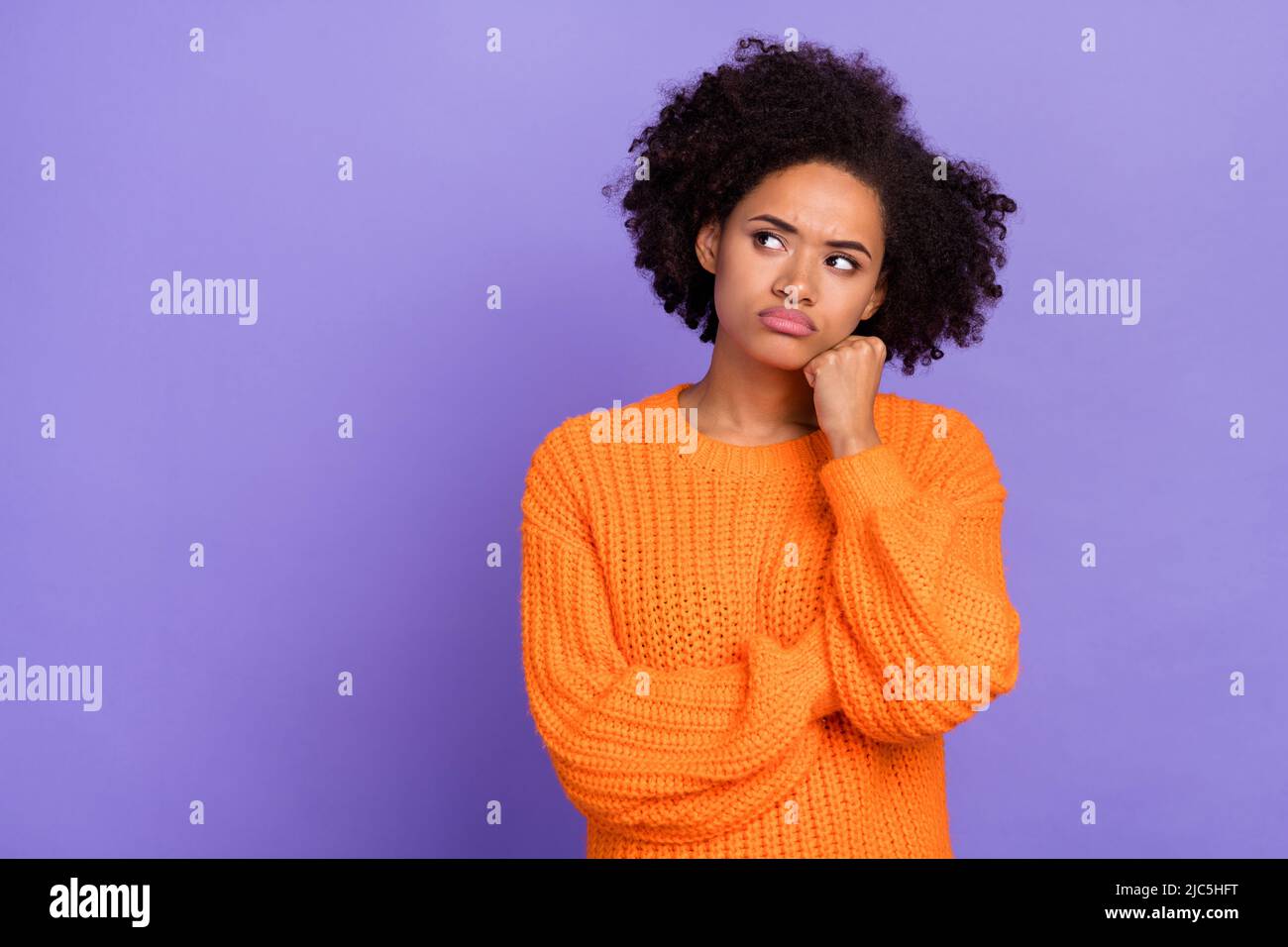 Portrait of attractive moody sullen girl thinking deciding copy space ...