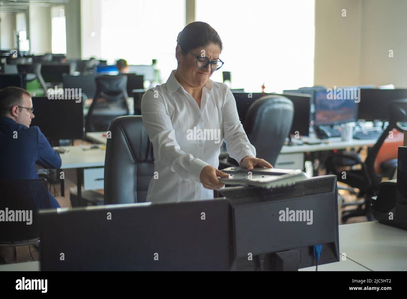 Woman angry computer typing hi-res stock photography and images - Alamy