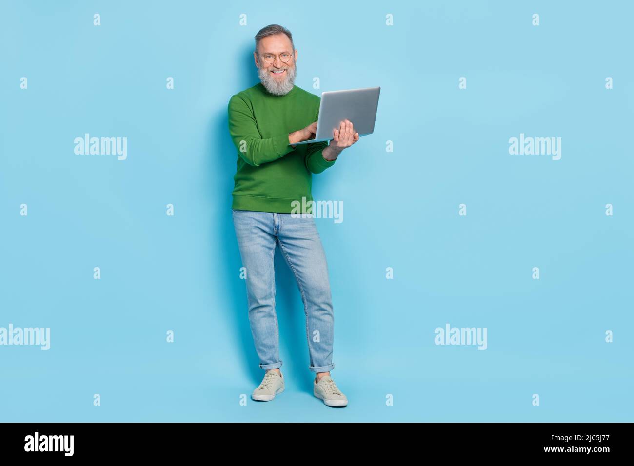 Full body photo of smart ceo aged man use netbook communication wear ...