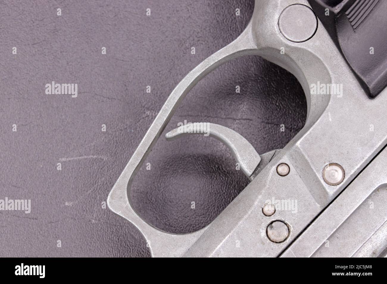 Close-up pistol barrel on black background Stock Photo - Alamy