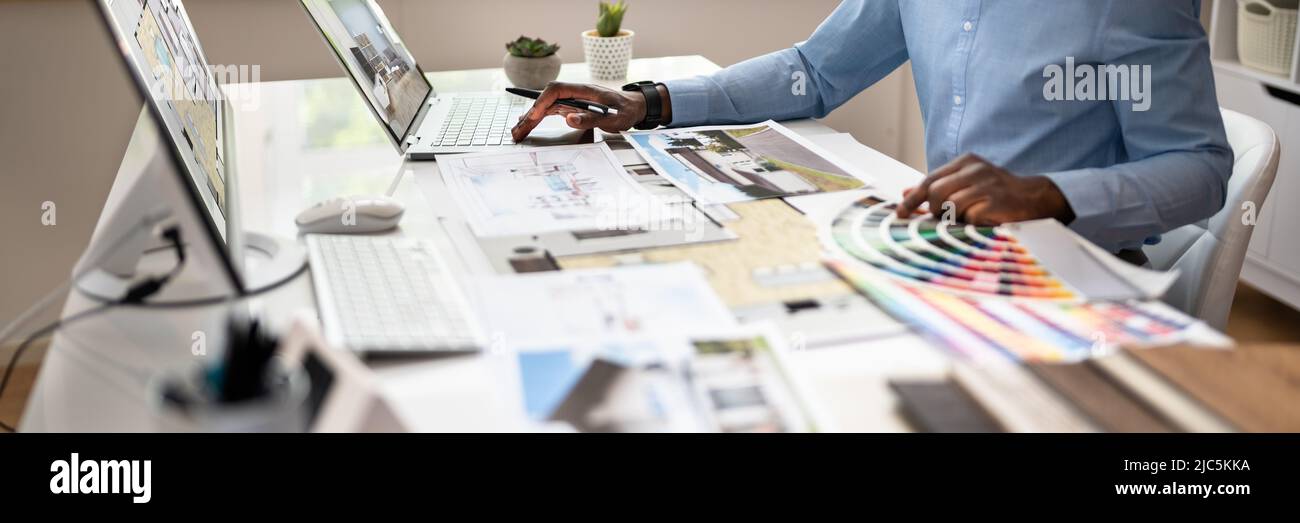 Side View Of Real Estate Designer Working On Computer In Office Stock ...