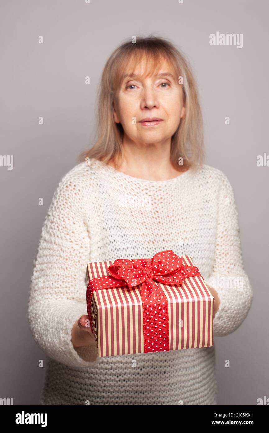 Present concept. Gift box in female hand Stock Photo - Alamy