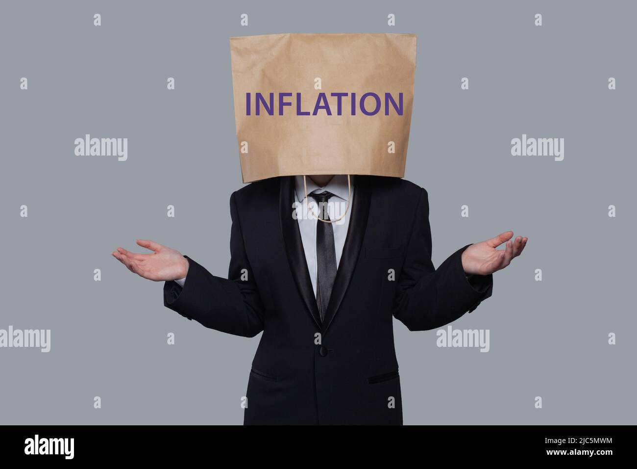 Sad businessman with craft paper bag on his head. Inflation concept ...
