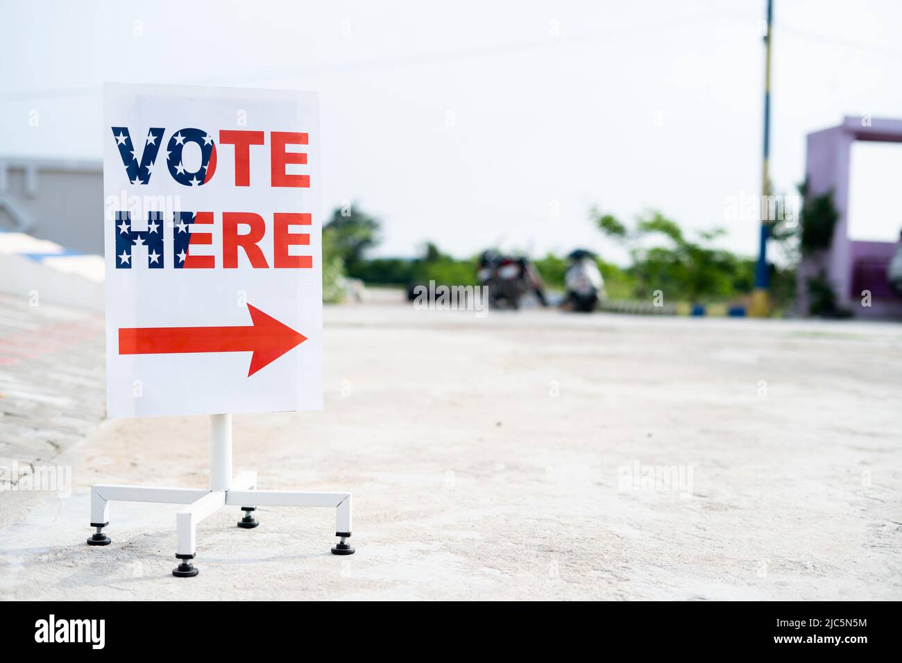 Vote here sign board placed near polling booth for showing direction to ...