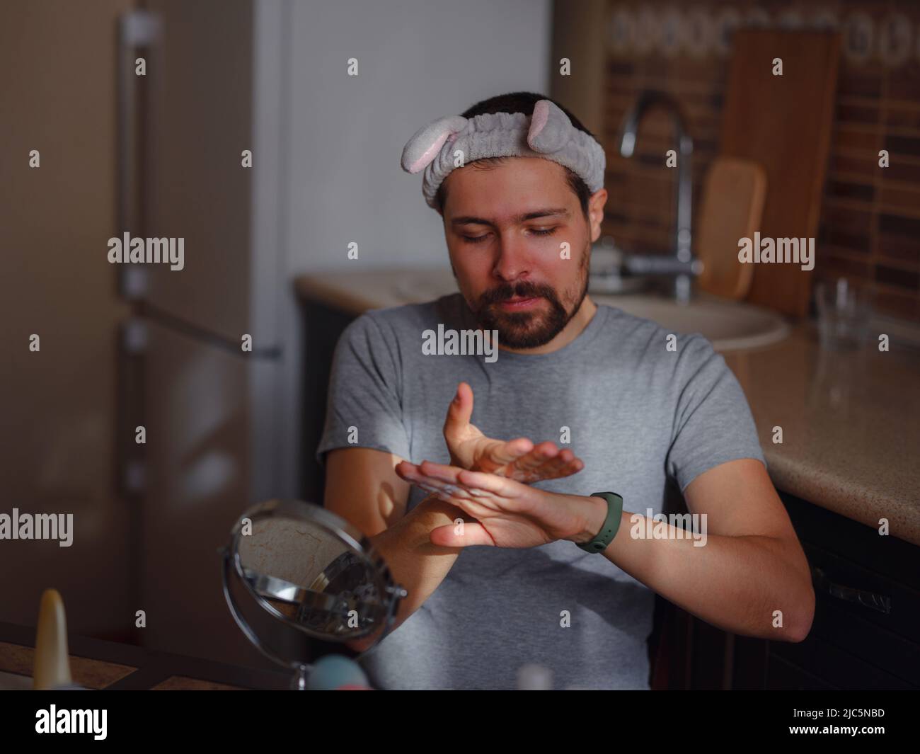 Men's beauty concept. caucAsian guy checking his skin. man with beard ...