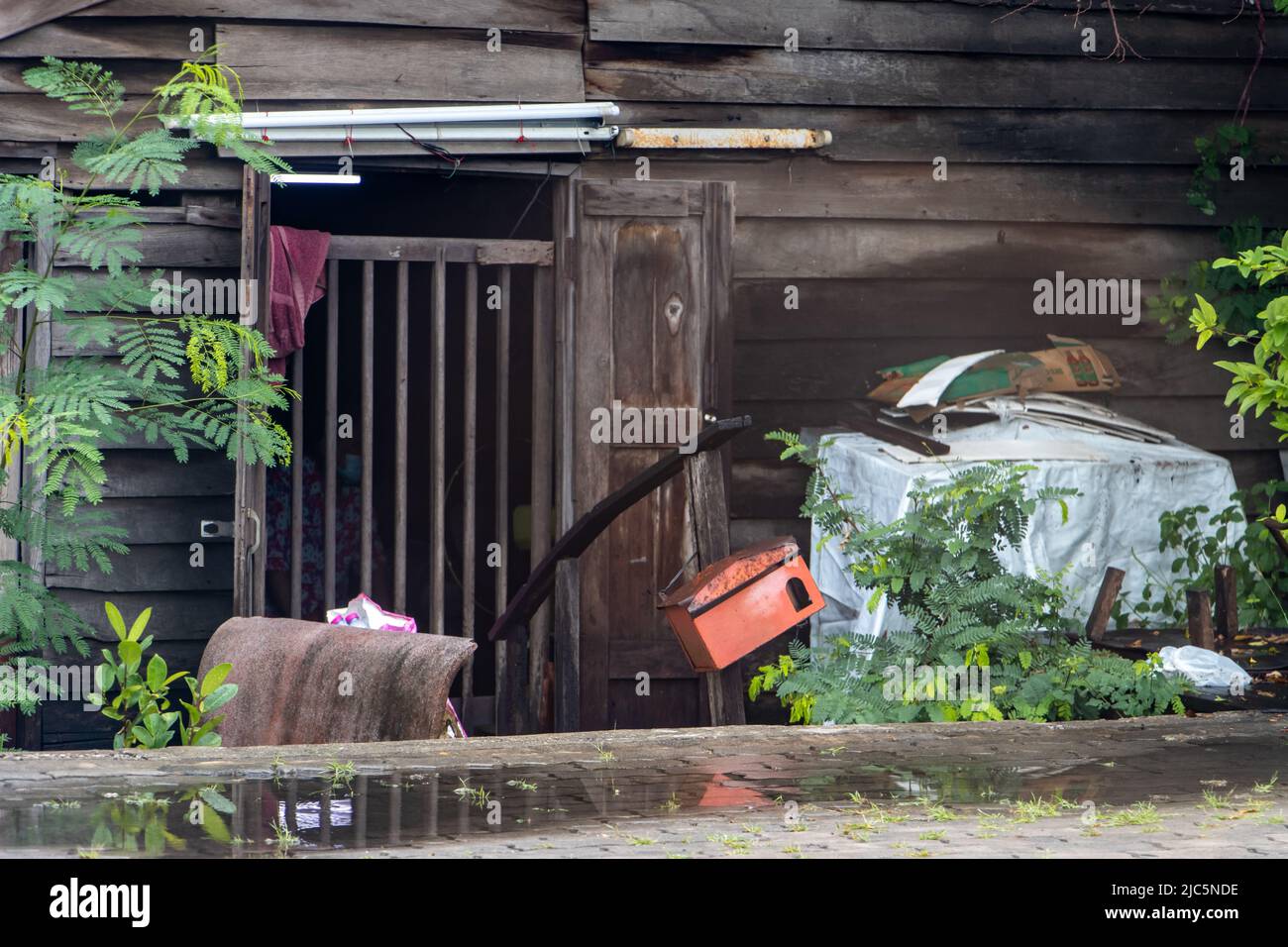 Entrance to a simple house below the level of the sidewalk Stock Photo ...